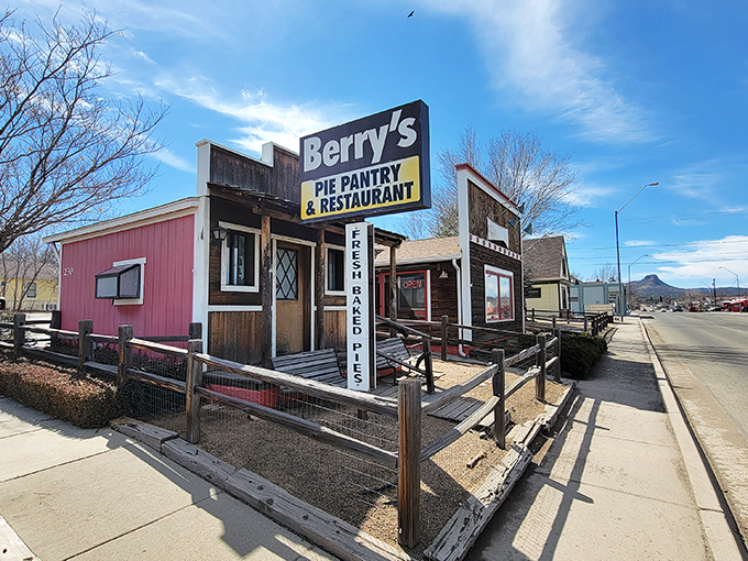 A charming pink building with rustic wooden accents, Berry's Pie Pantry beckons hungry travelers with its unassuming facade and promise of homemade goodness.