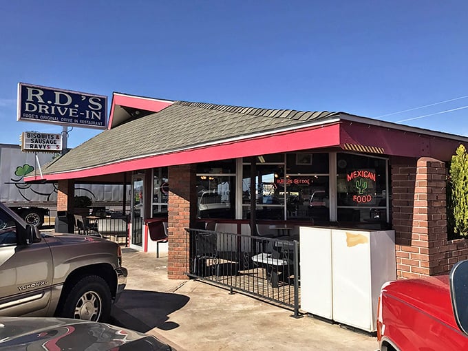 Exterior: The iconic blue and red signage of R.D.'s Drive-In stands as a beacon of nostalgia against the Arizona sky, promising comfort food and memories.