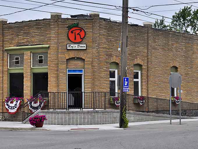 The stone facade of Roz's Diner stands proudly on the corner, its history as a century-old bank adding character that no modern restaurant could replicate.