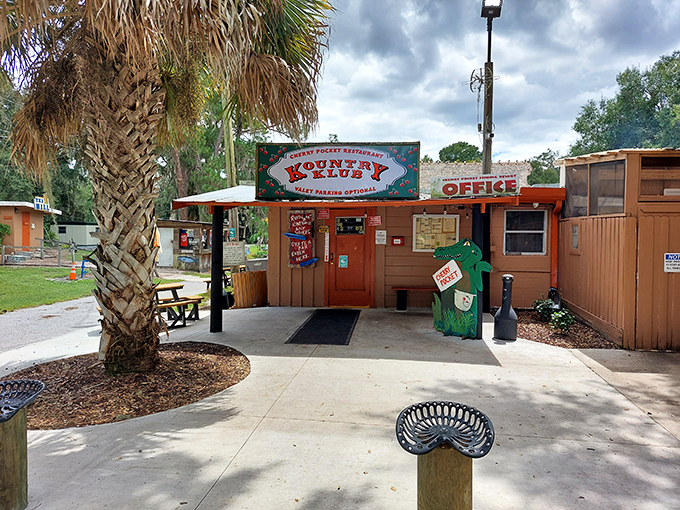 The unassuming entrance to Cherry Pocket beckons with old Florida charm &ndash; where palm trees and promises of seafood create an irresistible invitation.