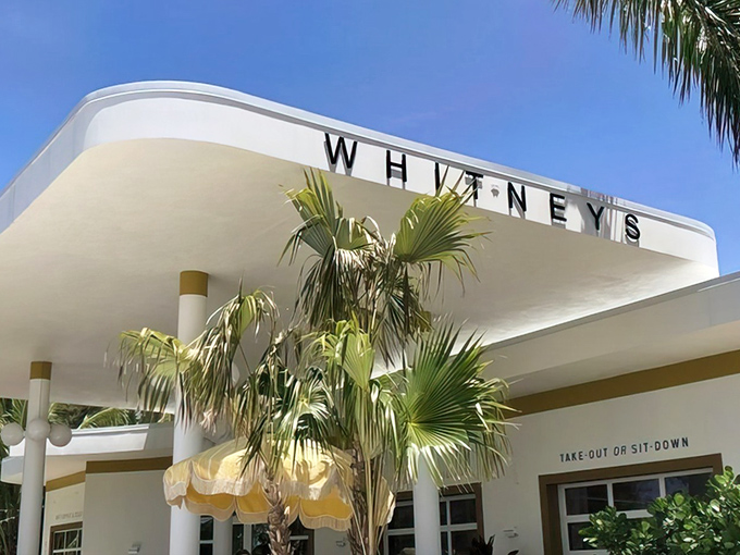 Whitney's sleek mid-century facade welcomes you with retro charm and swaying palms – Florida's architectural time capsule with modern culinary soul.