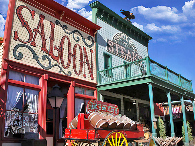 The iconic Old West facade of Pinnacle Peak beckons hungry travelers with its vibrant "SALOON" sign and authentic frontier charm.