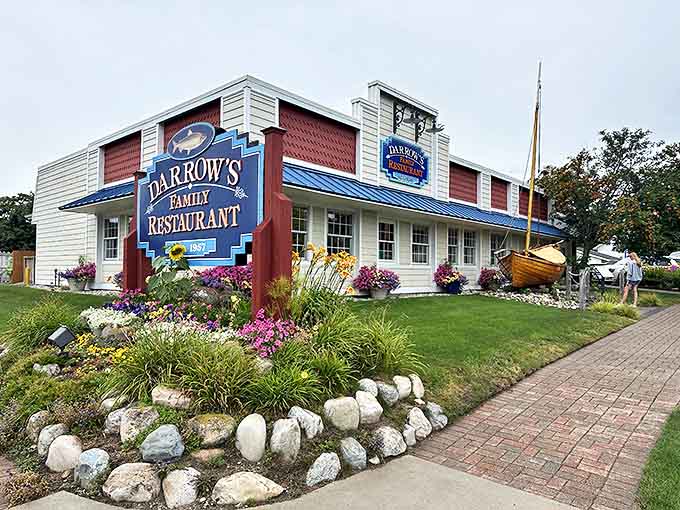 Darrow's Family Restaurant welcomes visitors with its charming nautical-themed exterior, complete with a wooden boat that hints at the Great Lakes heritage inside.