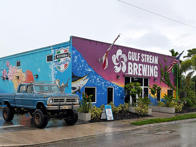 A vibrant splash of blue and purple announces Gulf Stream Brewing's presence, with a vintage Ford truck standing guard like a faithful mascot.