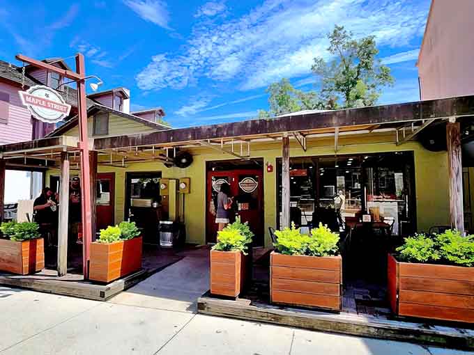 The sunny yellow exterior of Maple Street Biscuit Company beckons like a Southern lighthouse guiding hungry souls to biscuit paradise.