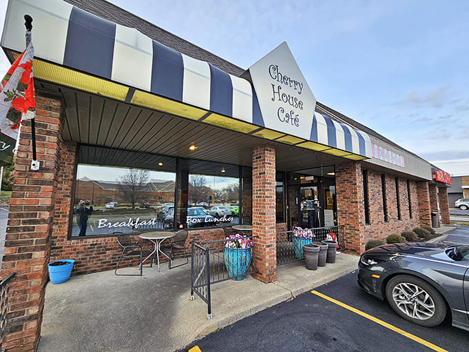 The iconic blue and white striped awning of Cherry House Café welcomes hungry visitors like a beacon of culinary comfort in Beavercreek Township.