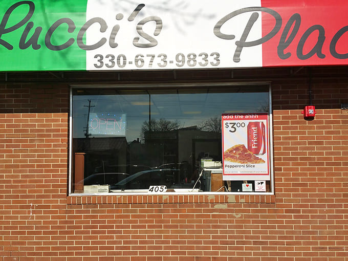 The Italian flag colors proudly announce Lucci's Place, a brick-faced slice of New York in Ohio's heartland, where pizza dreams come true.