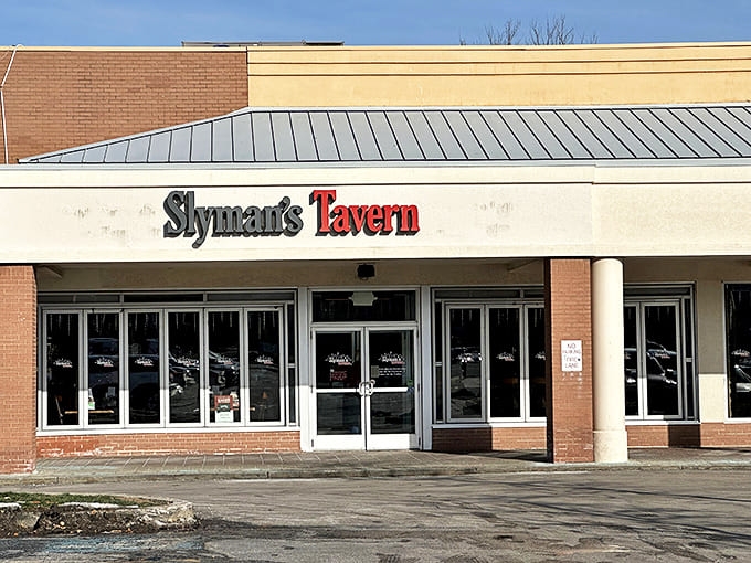 Slyman's Tavern exterior beckons with understated charm, hiding the colossal corned beef treasures waiting inside. No fancy frills needed when the sandwiches speak volumes.