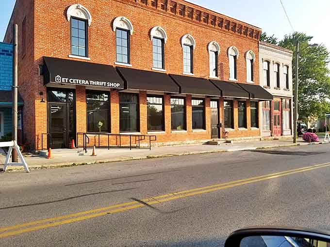 The stately brick exterior of Et Cetera Thrift Shop stands like a treasure chest waiting to be opened, its classic architecture hinting at the vintage wonders within.