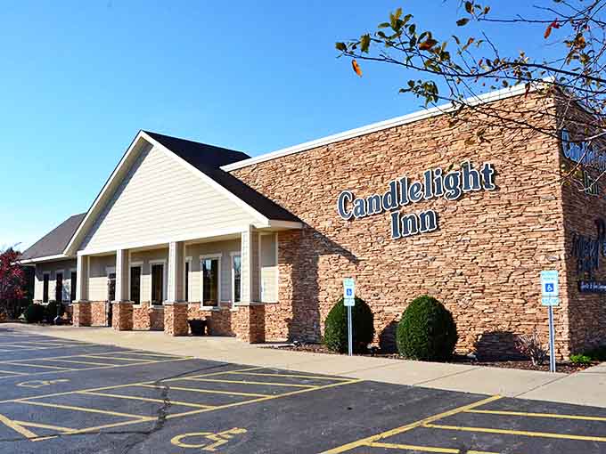 The stone facade of Candlelight Inn stands proudly in Rock Falls, promising comfort and legendary chicken within its welcoming walls.