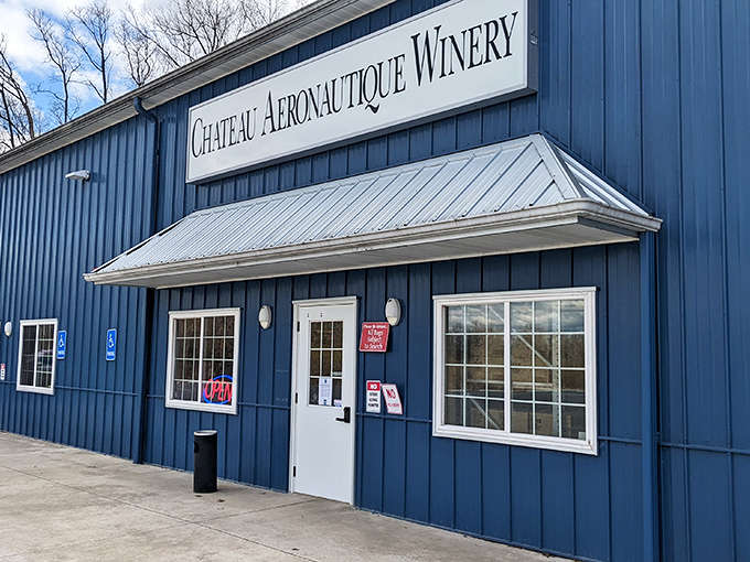 The striking blue exterior of Chateau Aeronautique Winery stands like a beacon for thirsty travelers, promising aviation-themed delights within.