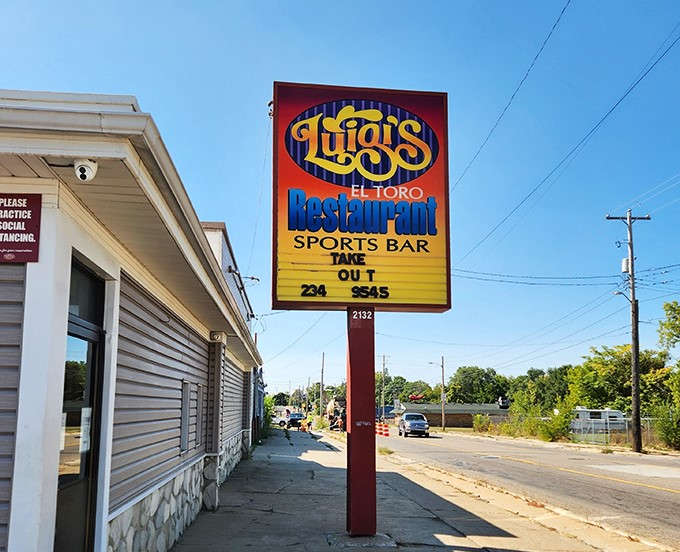 Luigi's vibrant sign stands as a beacon for pizza lovers, promising Italian delights and sports bar fun in Flint.