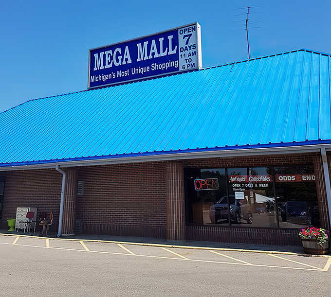 The iconic bright blue roof of Mega Mall stands out against the Michigan sky, promising treasures beyond its humble brick exterior.