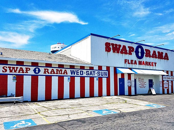 The red and white striped exterior of Swap-O-Rama stands like a retail circus tent, promising treasures within that no algorithm could ever predict.