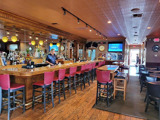 The 10-12 Lounge welcomes thirsty travelers with its warm wooden bar and local memorabilia, where strangers quickly become friends.