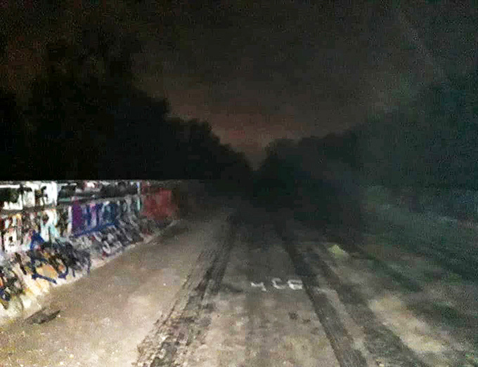 After dark, even the bravest visitors report strange sensations, as shadows play tricks along the abandoned roadway.