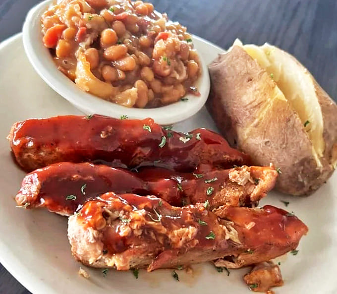 These aren't just ribs &ndash; they're meat candy with a side of beans that have been gossiping with bacon all day long.