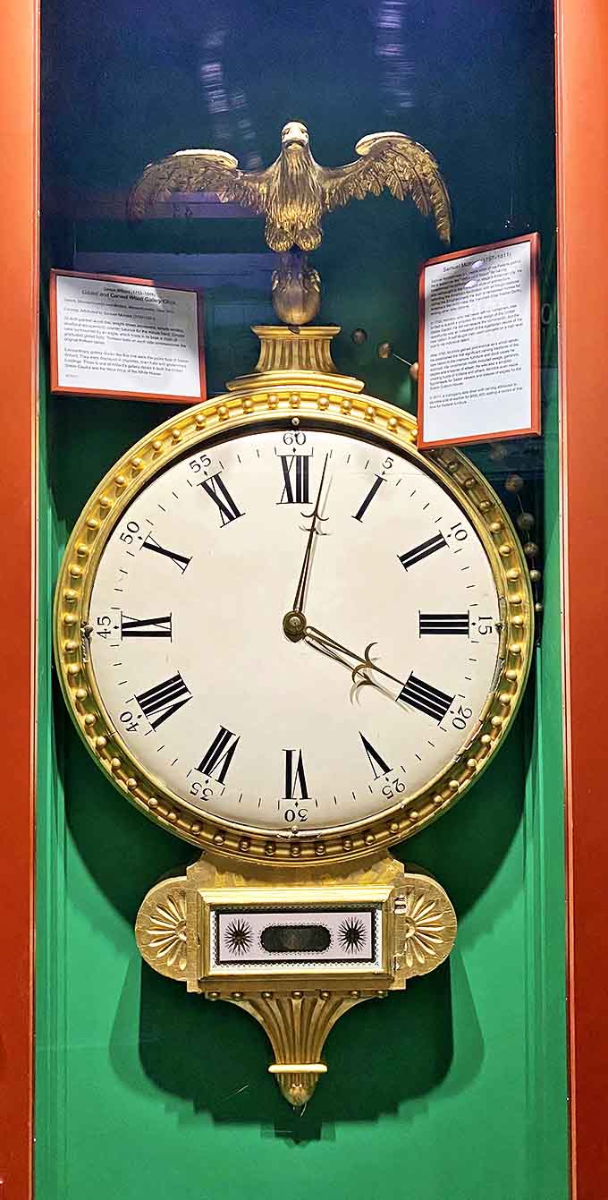 The golden eagle perched atop this banjo clock seems ready to soar, while the timepiece below steadfastly marks the hours with patriotic precision.
