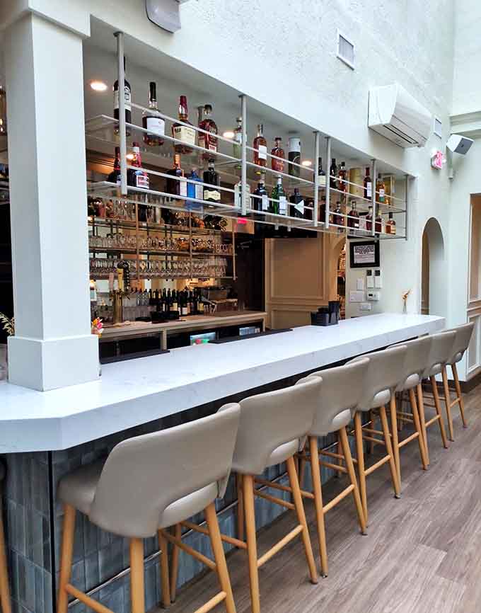 The bar isn't just stocked, it's curated – a liquid library of Italian spirits and craft cocktails that turn waiting for your table into a pleasure all its own.