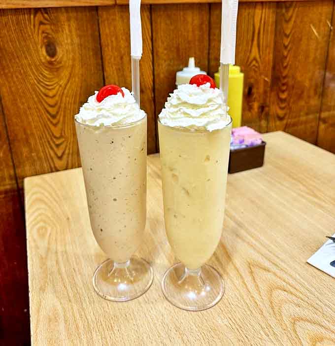 Malts so thick they're practically standing at attention, topped with whipped cream islands and cherry beacons.