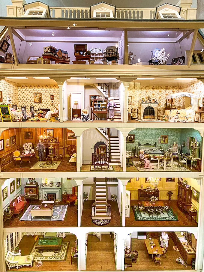 Five floors of perfectly appointed miniature living spaces reveal domestic life in cross-section, like a dollhouse designed by architectural geniuses with microscopic attention to detail.