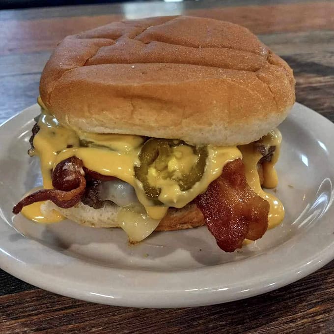 This burger defies gravity with its melted cheese cascading down the sides, bacon peeking out, and jalape&ntilde;os adding just the right kick.