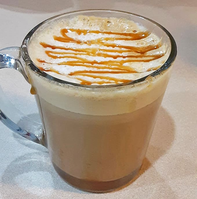 That caramel macchiato comes with artistic drizzle work that's almost too pretty to drink, though you'll get over that hesitation quickly.