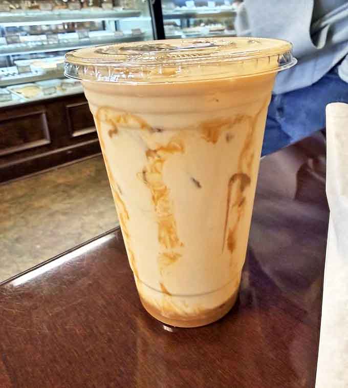 Swirls of amber sweetness cascade through cold coffee like a liquid sunset &ndash; the perfect companion for any baked indulgence.