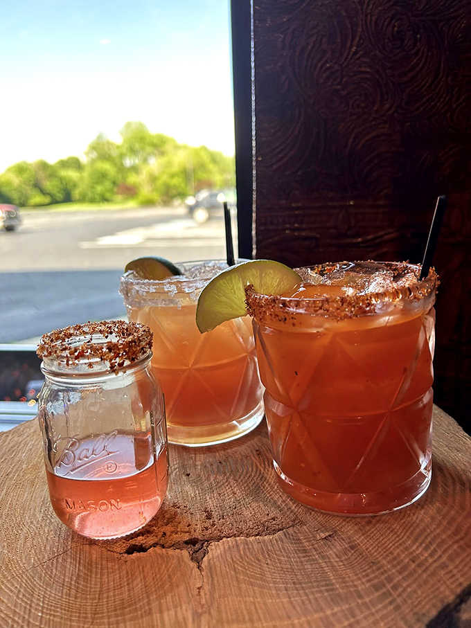 Mason jar cocktails with perfectly spiced rims – because great barbecue deserves equally thoughtful libations to wash it down.