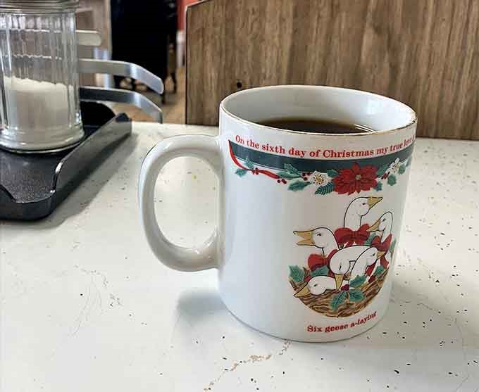 Coffee: Served in a Christmas mug because every day deserves to feel special &ndash; hot, strong, and constantly refilled.