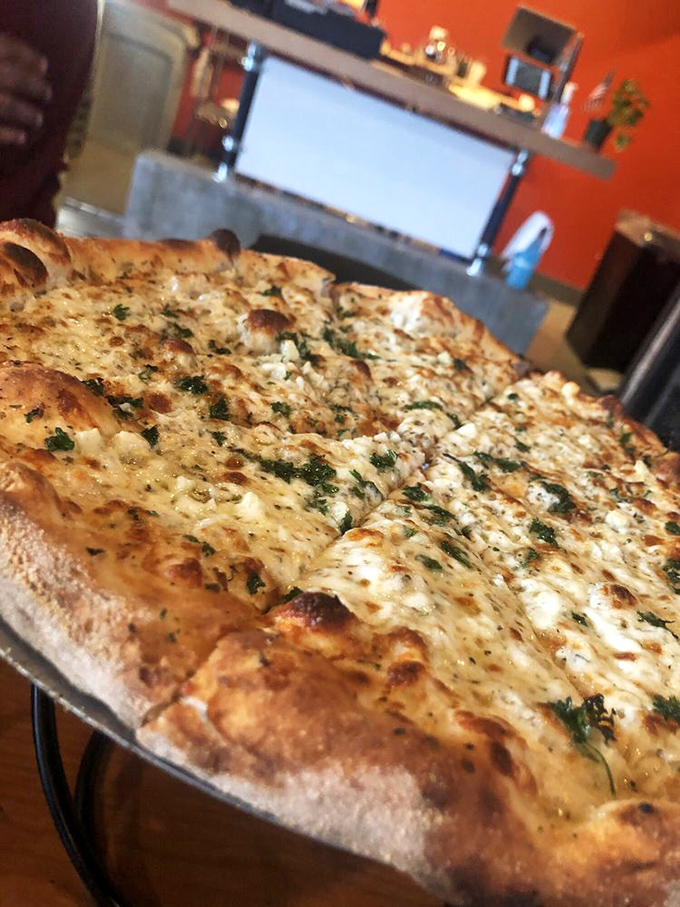 Sometimes simplicity speaks volumes &ndash; this cheese and herb pizza whispers of Italian grandmothers and their timeless wisdom.
