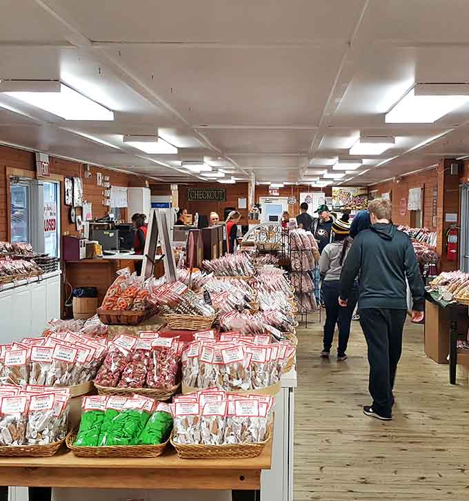 Locals and travelers alike browse the wooden-walled wonderland, united in their quest for exceptional cheese and specialty foods.