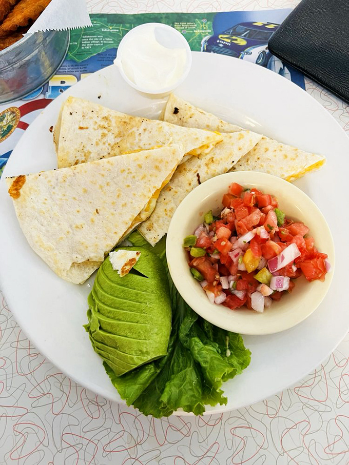 A quesadilla that doesn't understand the concept of modesty – stuffed with chicken, cheese, and enough flavor to make your taste buds dance.