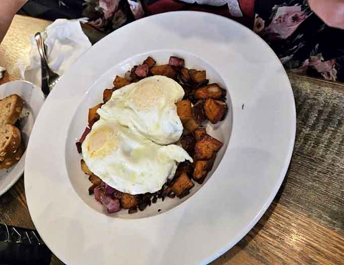 Corned beef hash crowned with perfectly cooked eggs &ndash; a savory mountain of breakfast joy that puts canned versions to absolute shame.