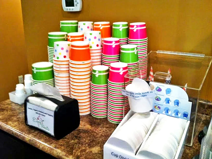 Colorful cups stacked like a dessert skyline – each one representing a future moment of happiness waiting to be filled.