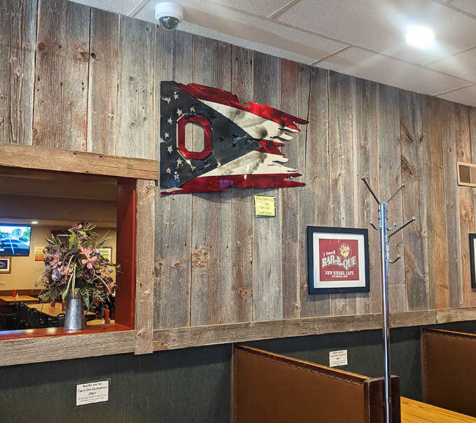 The Ohio state flag proudly displayed among rustic wood paneling &ndash; patriotism and comfort food go hand in hand here.