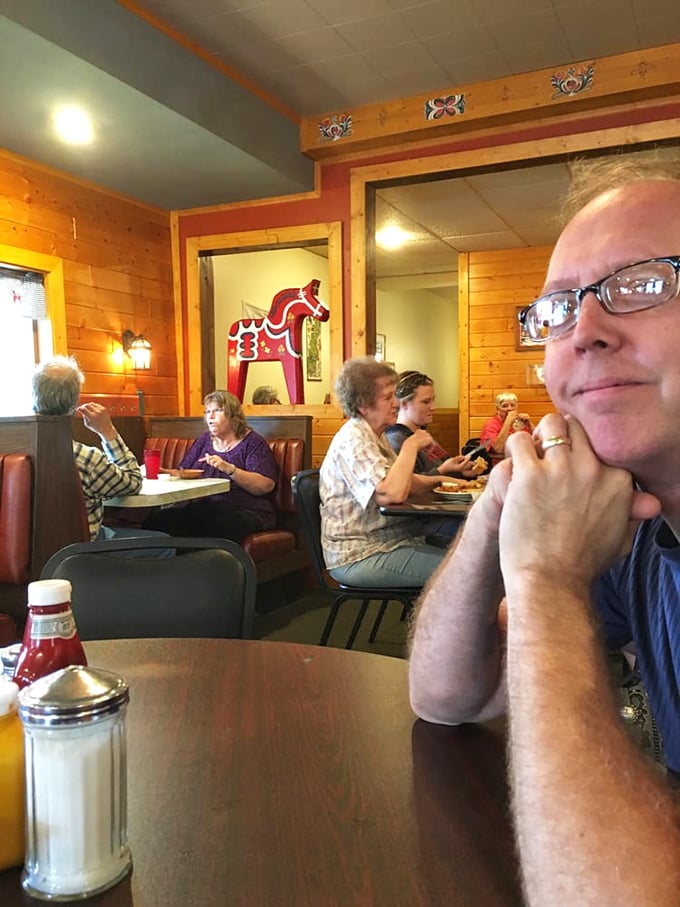 Regular customers settle into their usual spots, where conversations flow as freely as the coffee in this living museum of small-town America.
