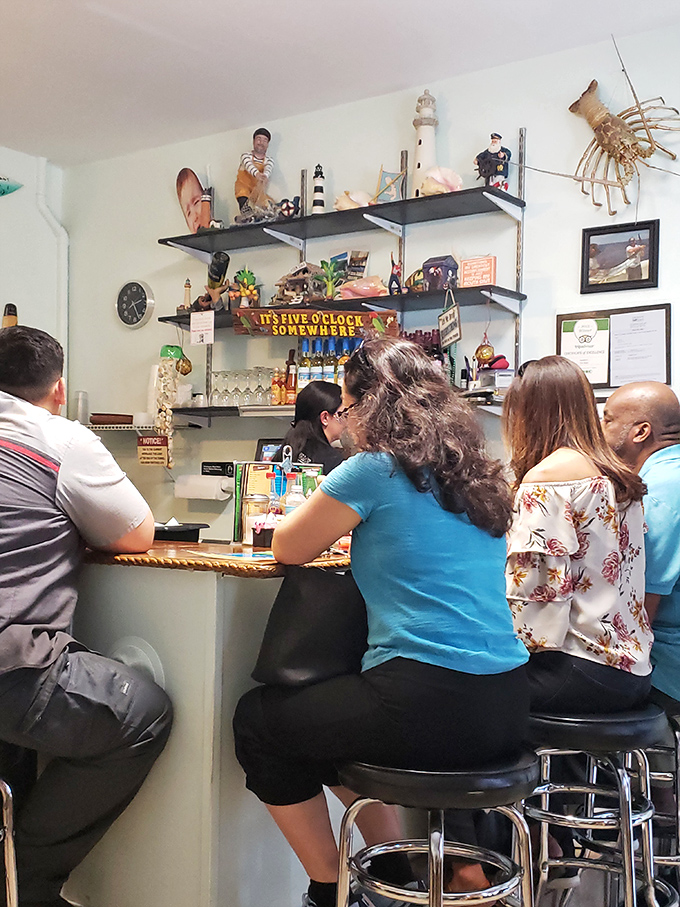 Where locals gather at the counter, trading recommendations and stories while nautical knick-knacks watch from overhead shelves.