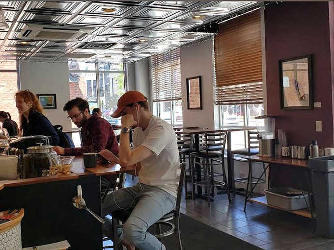 The caf&eacute; hums with the energy of Columbus locals who've discovered this hidden gem &ndash; each in their own world yet part of something special.