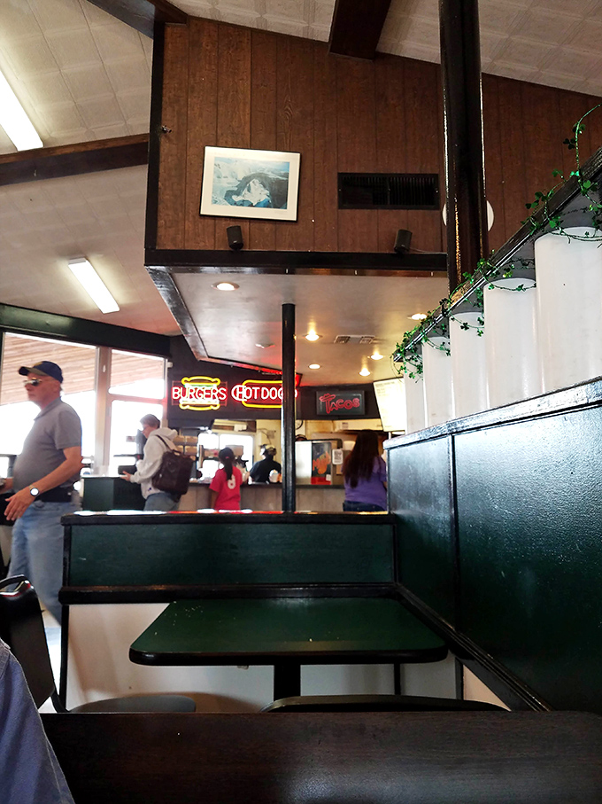 Stained glass light fixtures cast a warm glow over the dining room, where modern life slows down just enough to savor the moment.