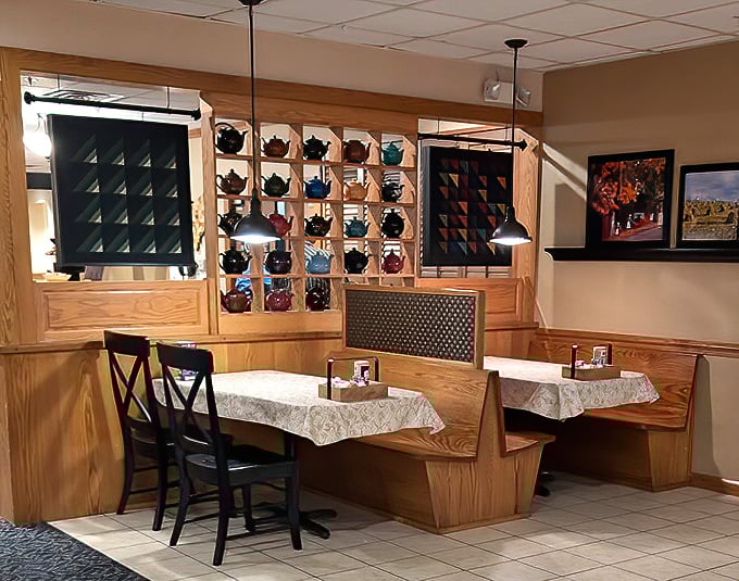 A cozy booth framed by that signature teapot display &ndash; the perfect spot to contemplate whether you have room for a second helping.
