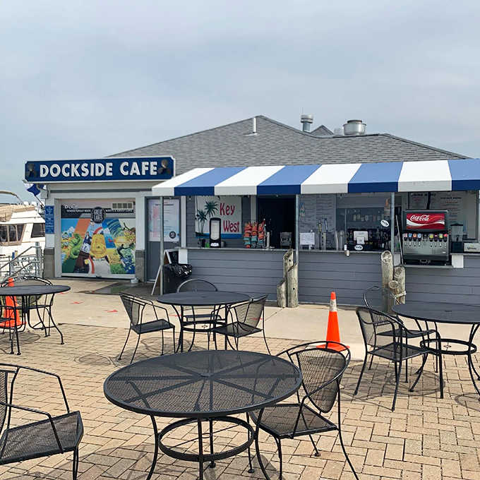 Metal tables scattered across the brick patio create the perfect casual atmosphere for enjoying Lake Erie's gentle breezes between bites.
