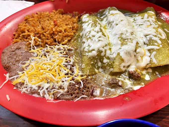 These enchiladas verdes are swimming in sauce and covered in cheese, basically living their best life on your plate.