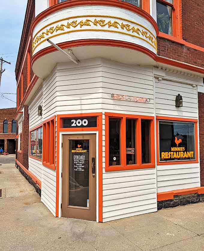 The bright orange-red trim against white siding makes this former post office impossible to miss as you explore downtown Allegan.