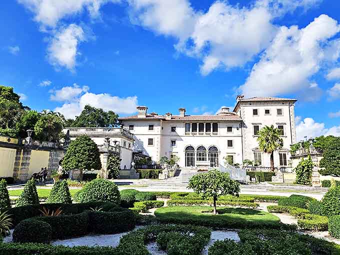 The villa's symmetrical grandeur commands attention against Miami's blue skies, a limestone love letter to Renaissance Italian design.