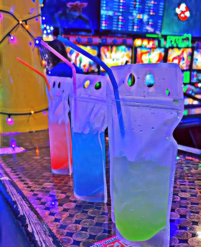 Colorful cocktail pouches glow under arcade lights &ndash; adult juice boxes that bring playful presentation to serious libations.