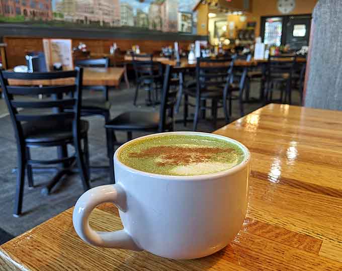 A perfectly crafted matcha latte demonstrates the baristas' skills extend beyond traditional coffee drinks to satisfy every preference.