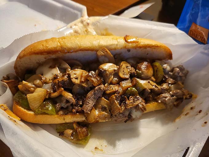 A satisfying cheesesteak hoagie, loaded with savory steak, mushrooms, and veggies. Grab a napkin and dig in!