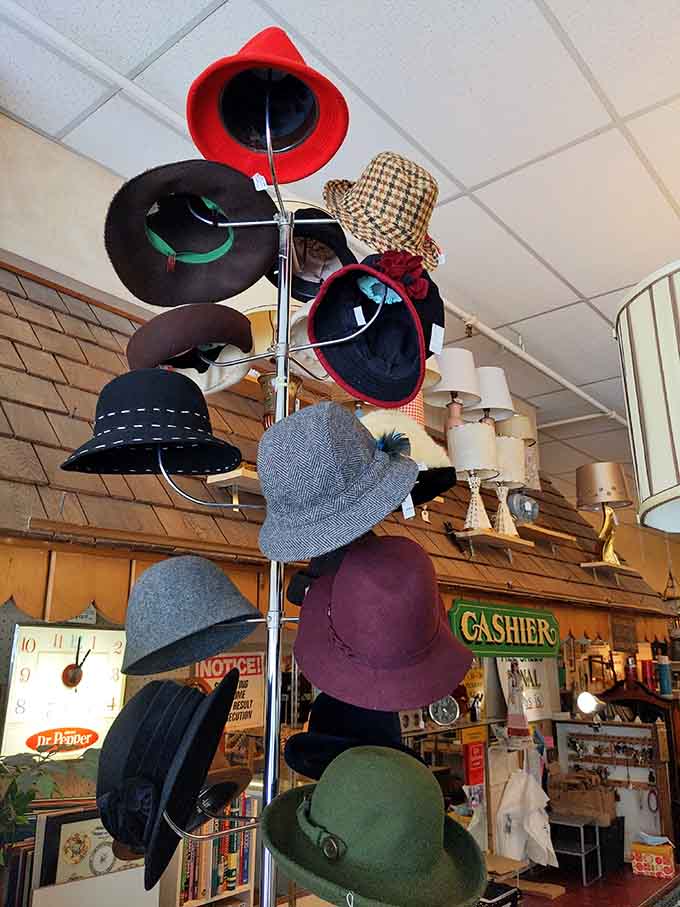 A tower of vintage hats offers everything from practical to theatrical, perfect for anyone who believes life's too short for boring headwear.