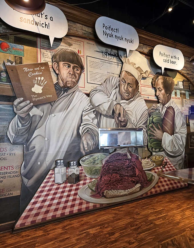 The Three Stooges mural watching over diners &ndash; sandwich guardians ensuring proper enjoyment of every bite.